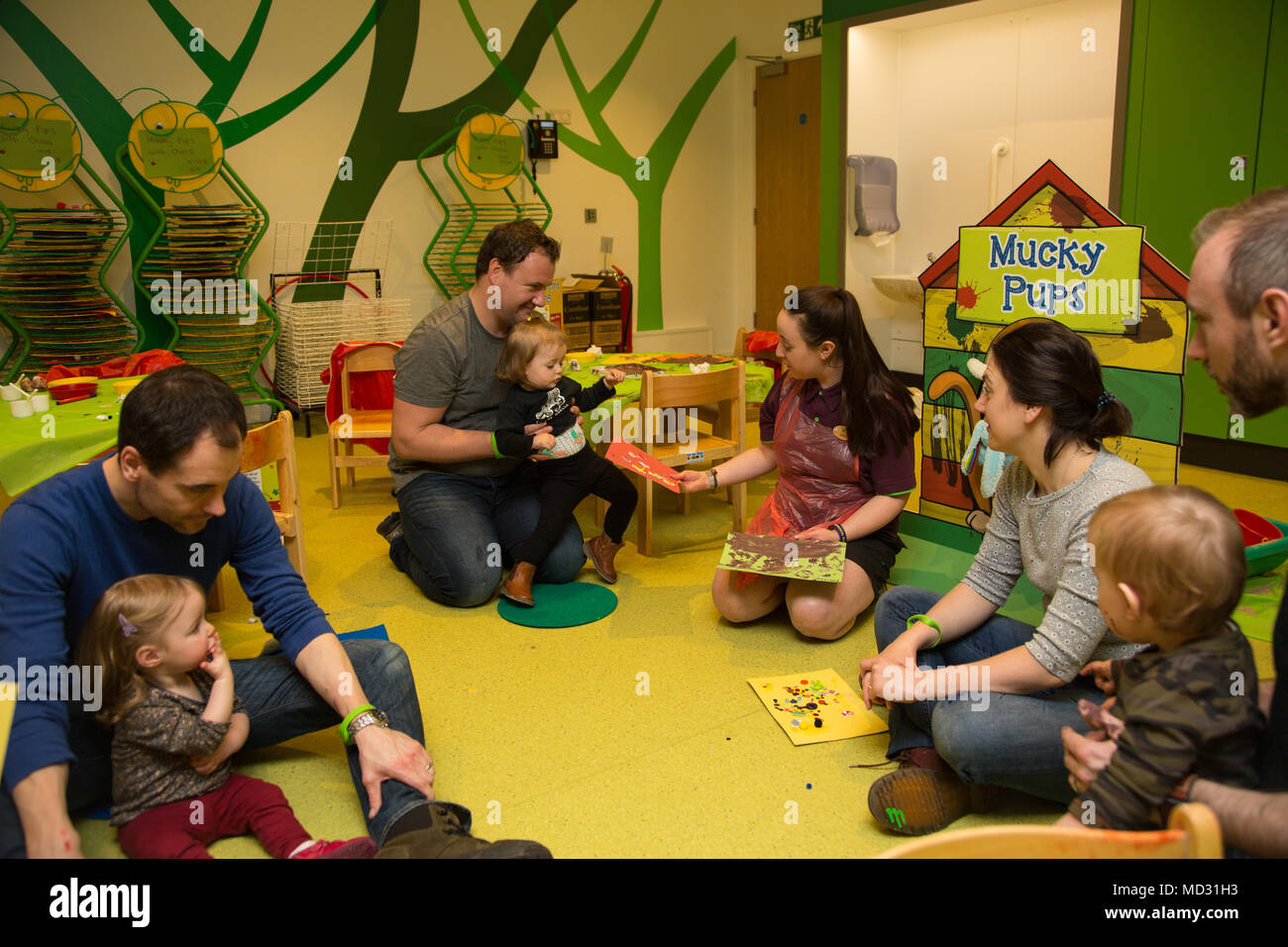 Baby sitting on dads lap hi-res stock photography and images - Alamy