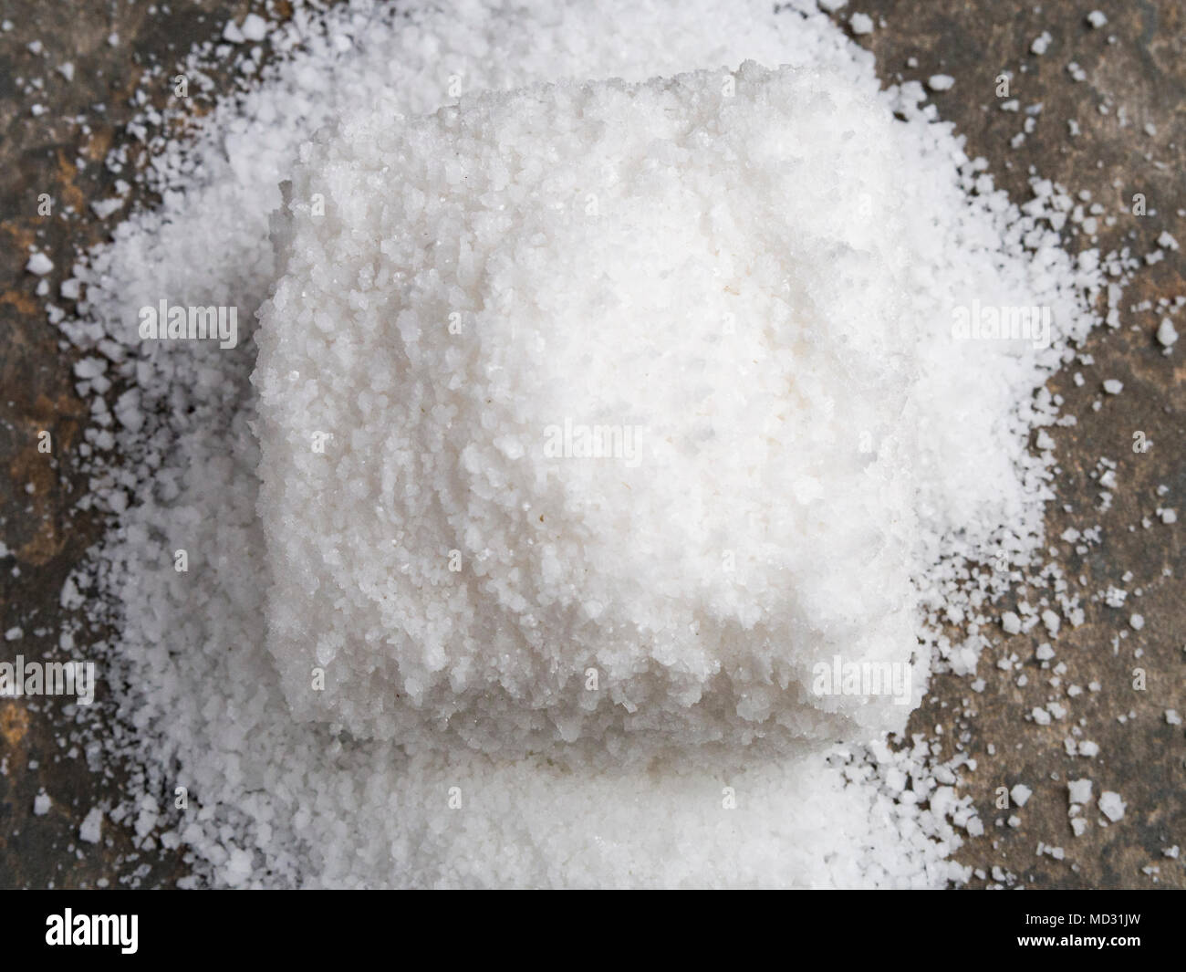 Block of salt on brown background Stock Photo - Alamy