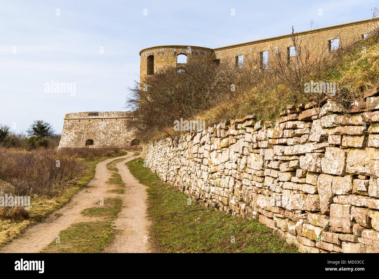 Historic castle ruin at Bornholm, Oland in Sweden. Gravel road outside ...