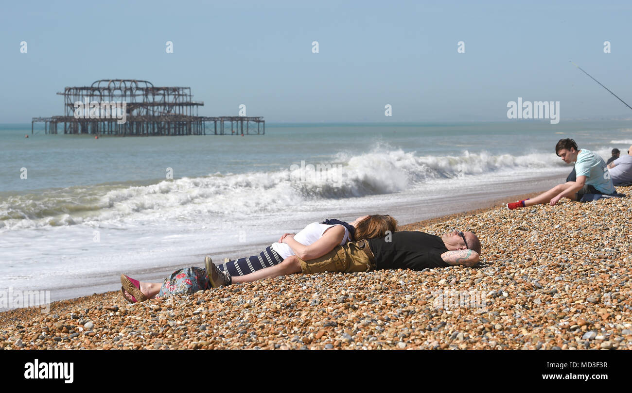 Brighton UK 18th April 2018 - Visitors enjoy the hot sunny weather on ...