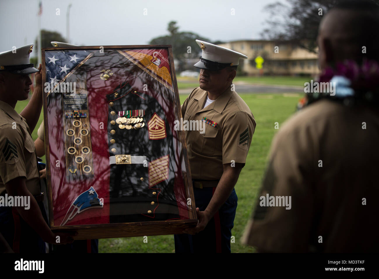 U.S. Marines with 3rd Radio Battalion present Sgt.Maj. Phillip Orellano ...