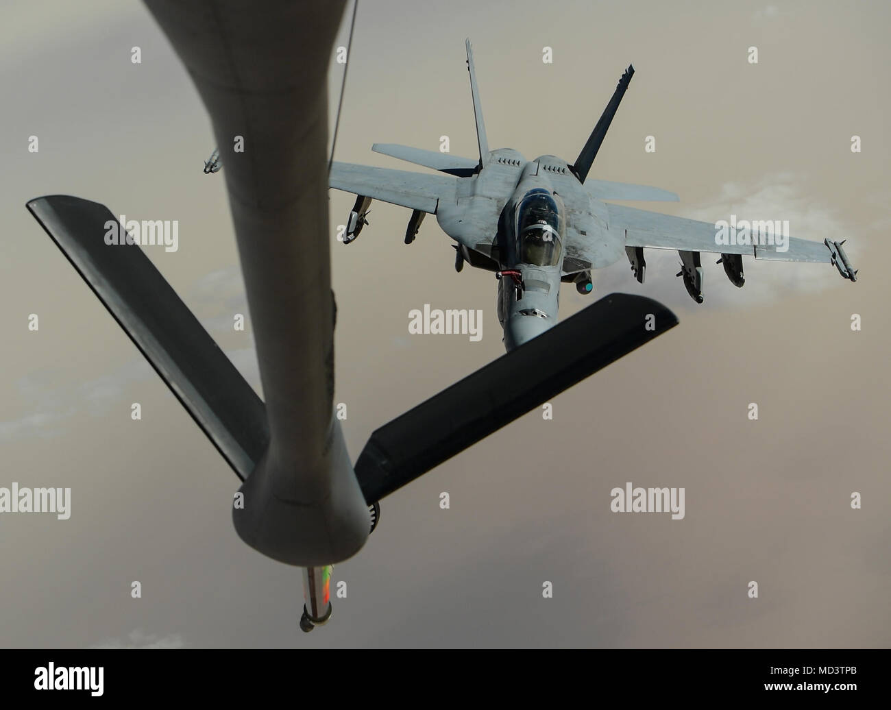A U.S. Navy F/A-18F Super Hornet receives fuel from a KC-135 ...