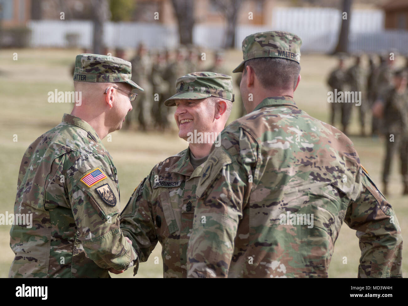 Command Sgt. Maj. Thomas J. Latter congratulates Command Sgt. Maj ...