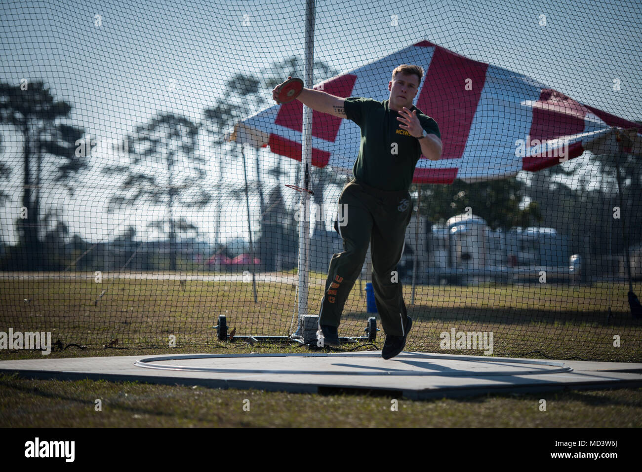 U.S. Marine Corps Staff Sgt. Justin Muhlhauser throws a discus during a ...
