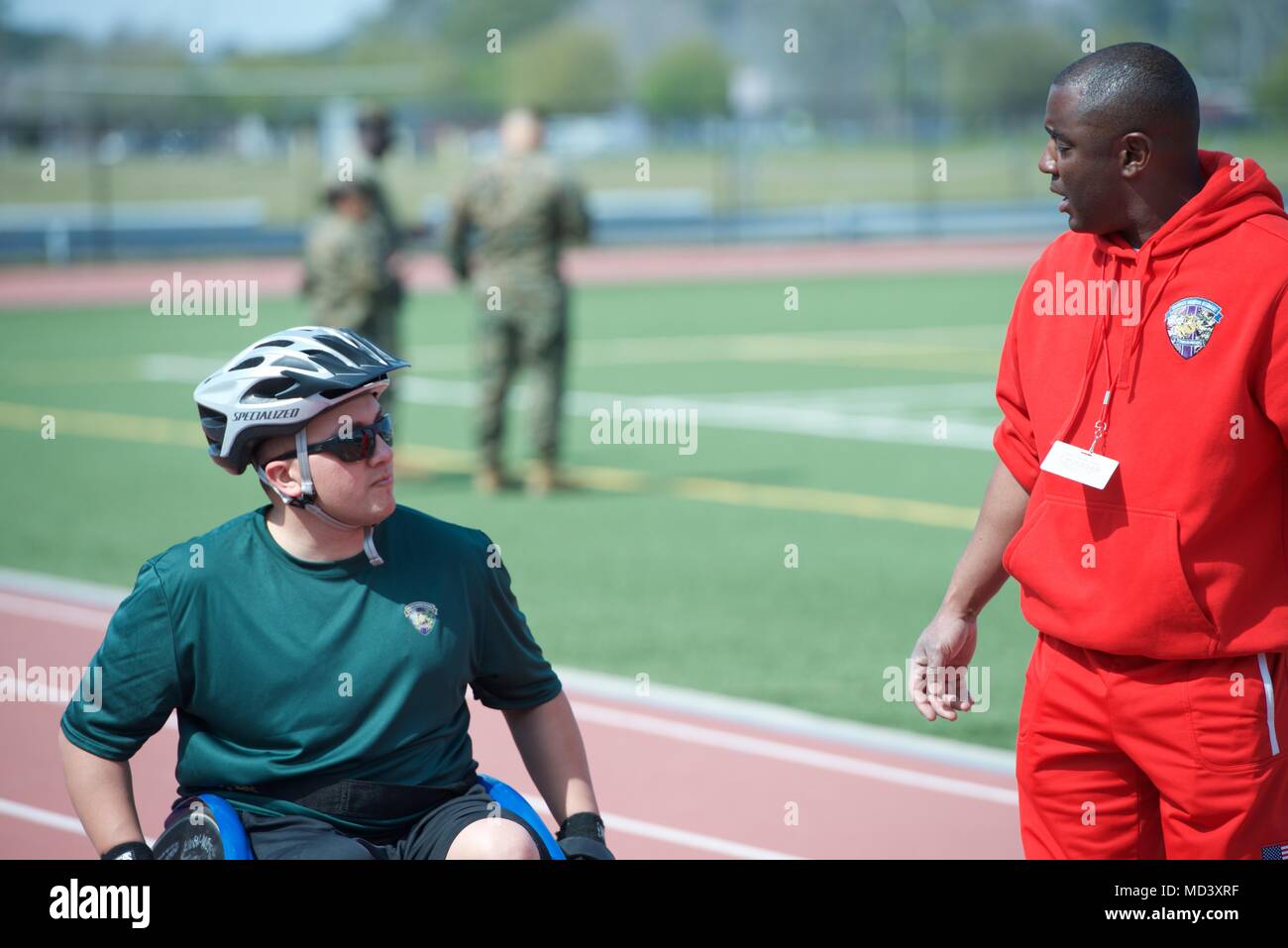 U.S. Marine Corps Staff Sgt. Tyler Terrones takes instruction from U.S ...