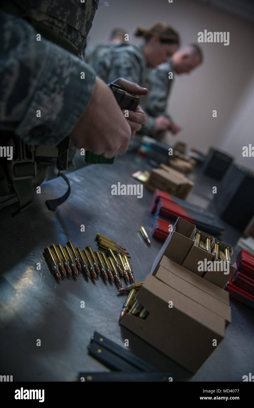Citizen Airmen with the 932nd Airlift Wing, load magazines in ...