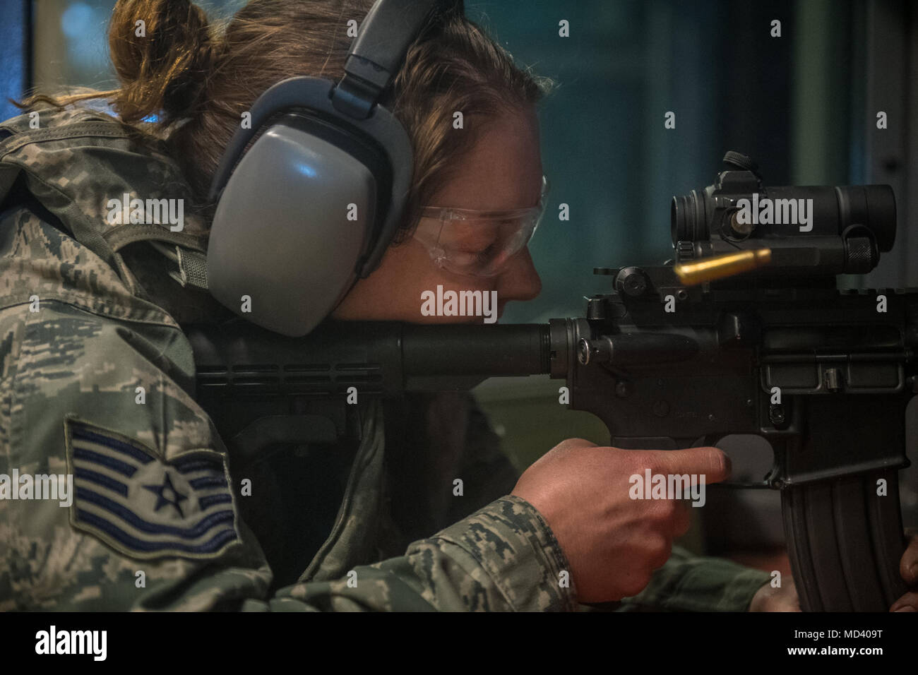 Tech. Sgt. Julie Goist, 932nd Medial Squadron technician, fires an M4 ...