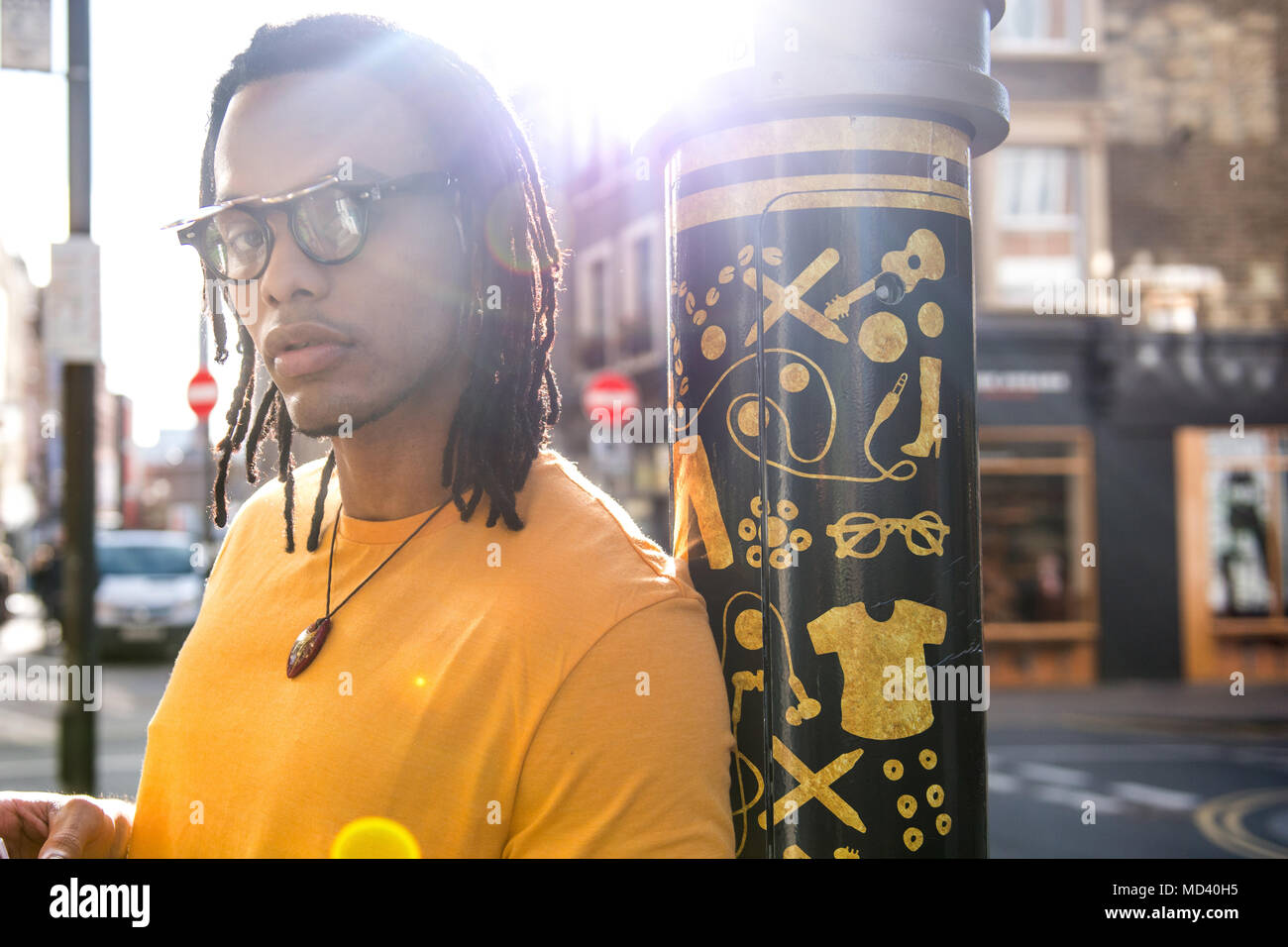 Male leaning against lamppost hi-res stock photography and images - Alamy