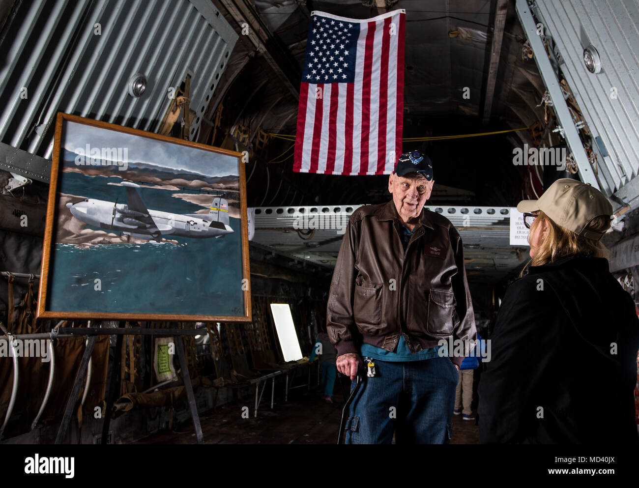 Retired Chief Master Sgt. Jack Pledger talk with a tour participant ...