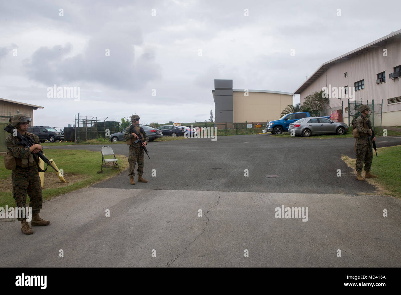 U.S. Marines with Marine Aircraft Group (MAG) 24 provide security for a ...