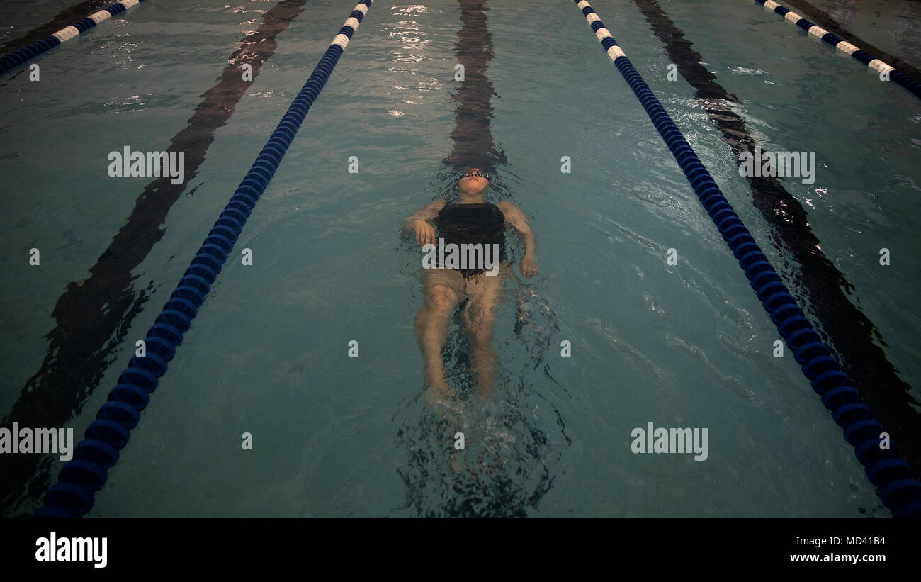 An athlete practices swimming on her back ahead of the 2018 Marine ...