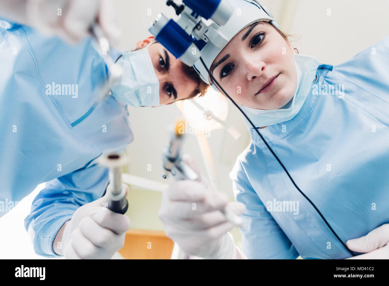 Dentist and dental nurse treating patient, personal perspective Stock ...