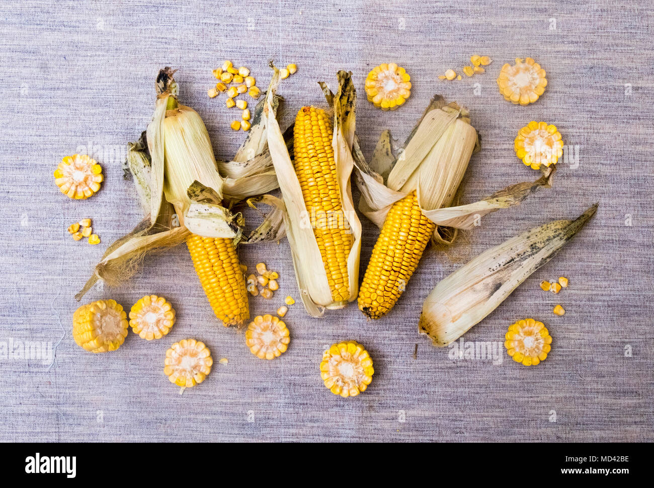 Corn on the cob with slices of corn, overhead view Stock Photo - Alamy