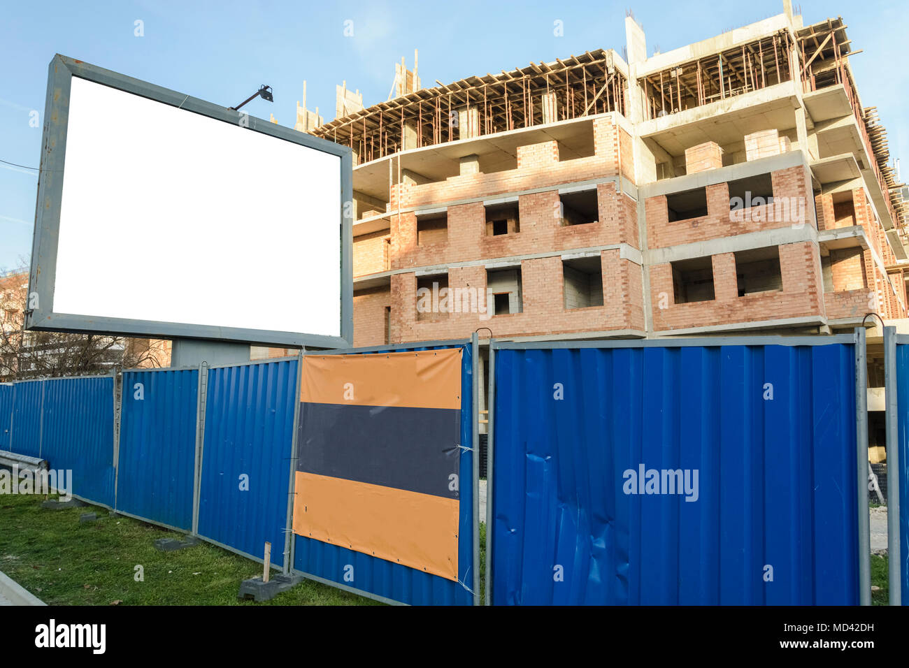 Blank billboard near a building in construction Stock Photo - Alamy