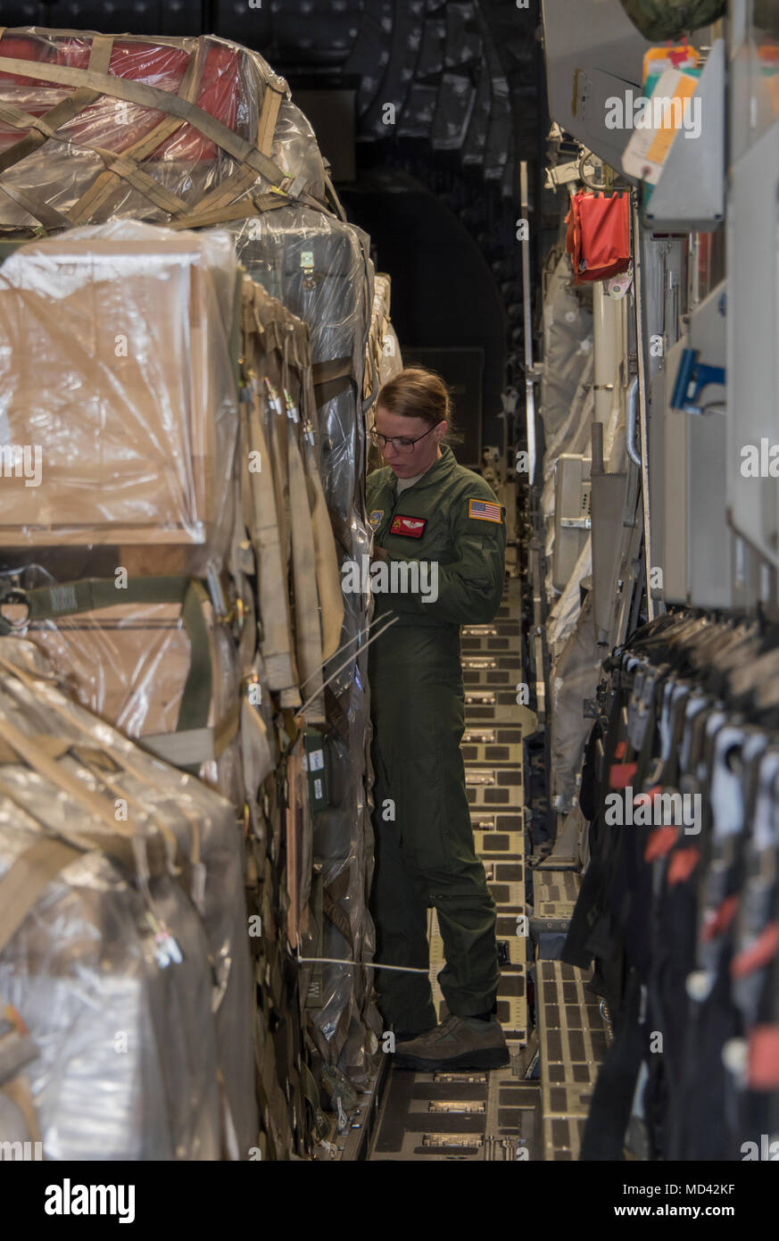 A 21st Airlift Squadron Airman conducts a pre-flight inspection prior ...