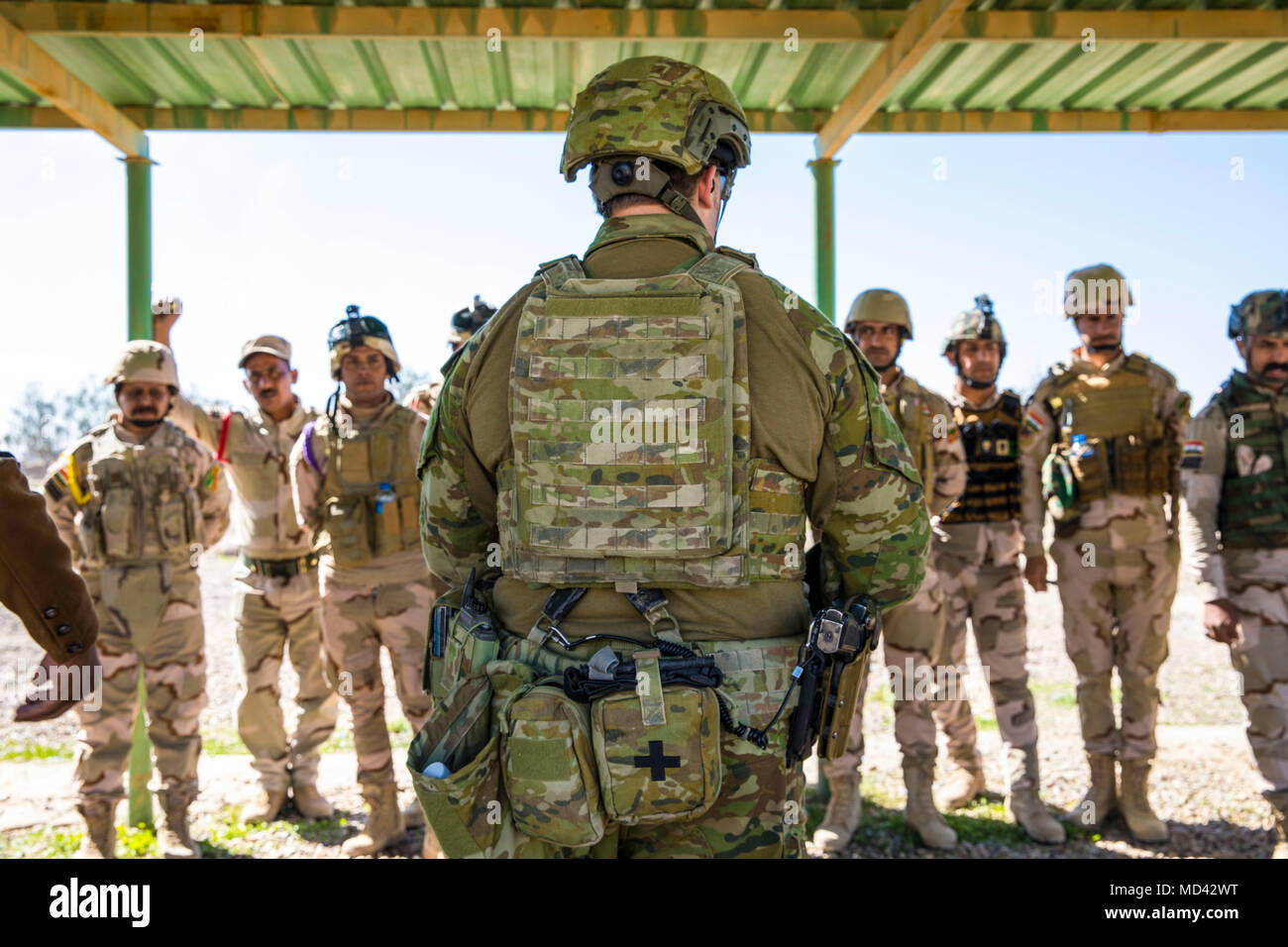 Australian army Sgt. Ryan Alman, with Task Force Taji, gives a safety ...