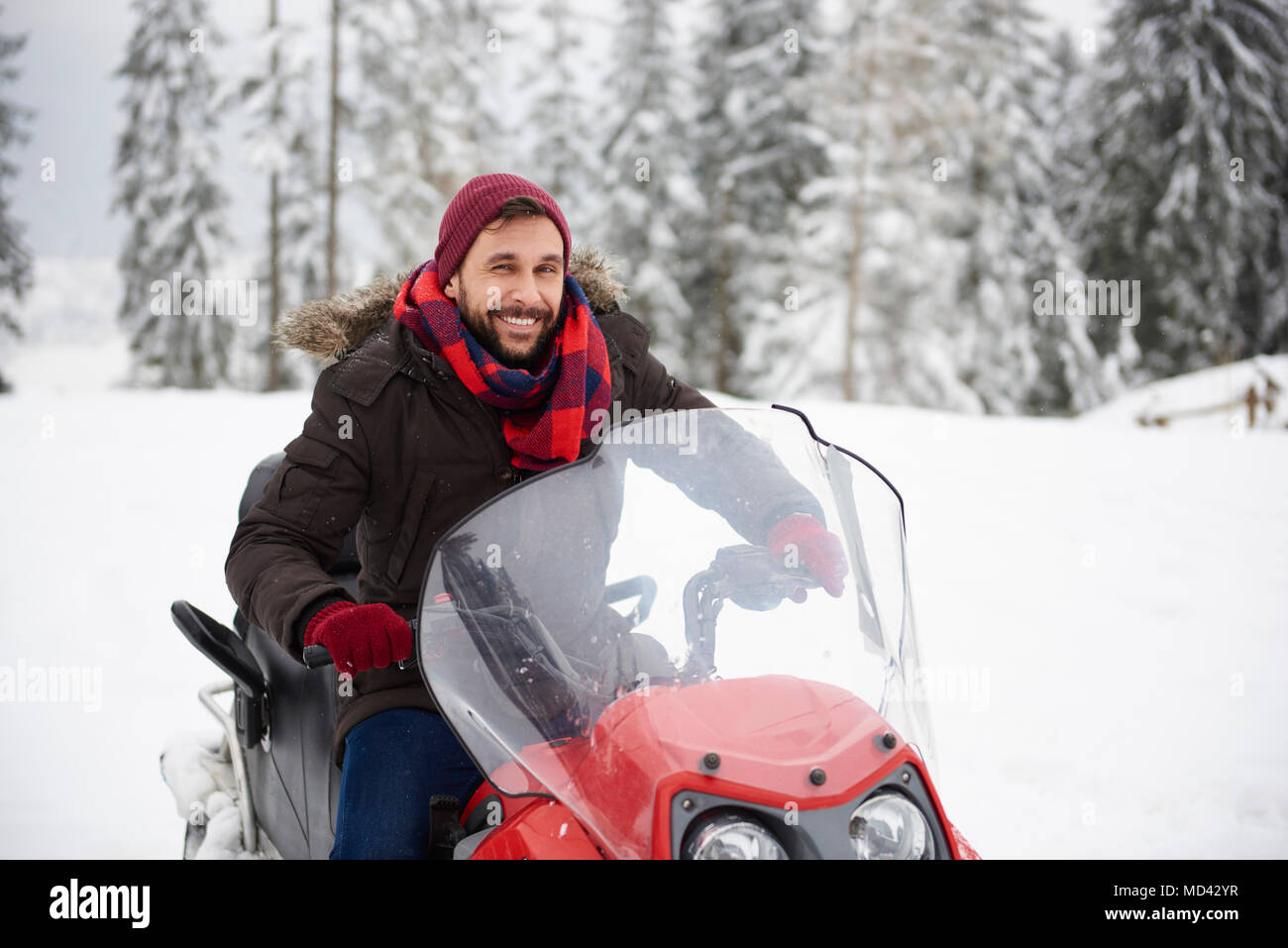 Man on snowmobile in hi-res stock photography and images - Alamy