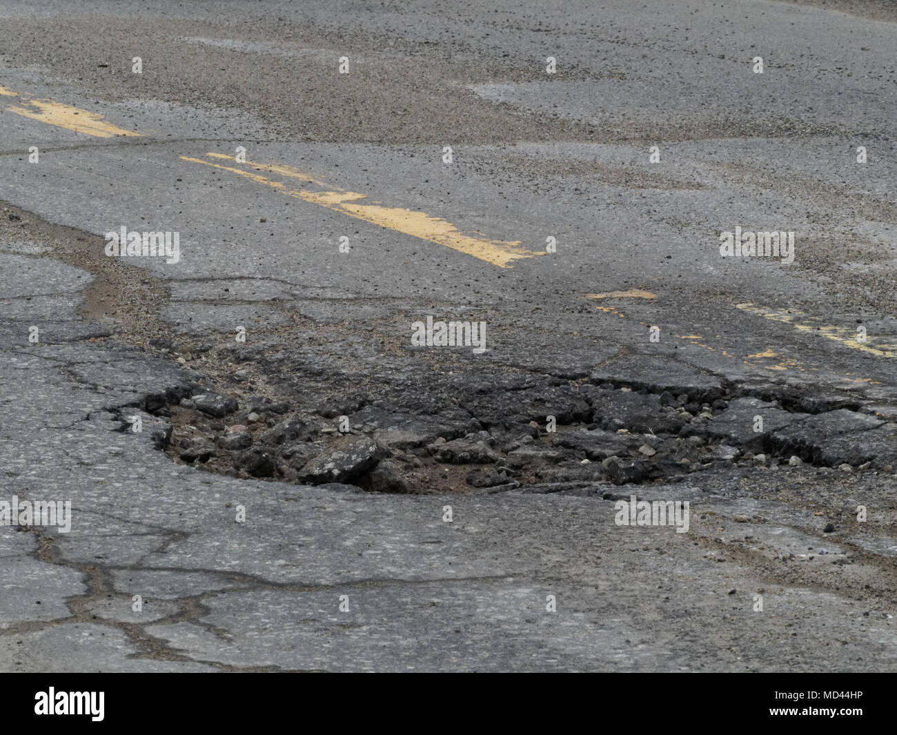 Quebec, Canada. Large pothole in asphalt road Stock Photo - Alamy