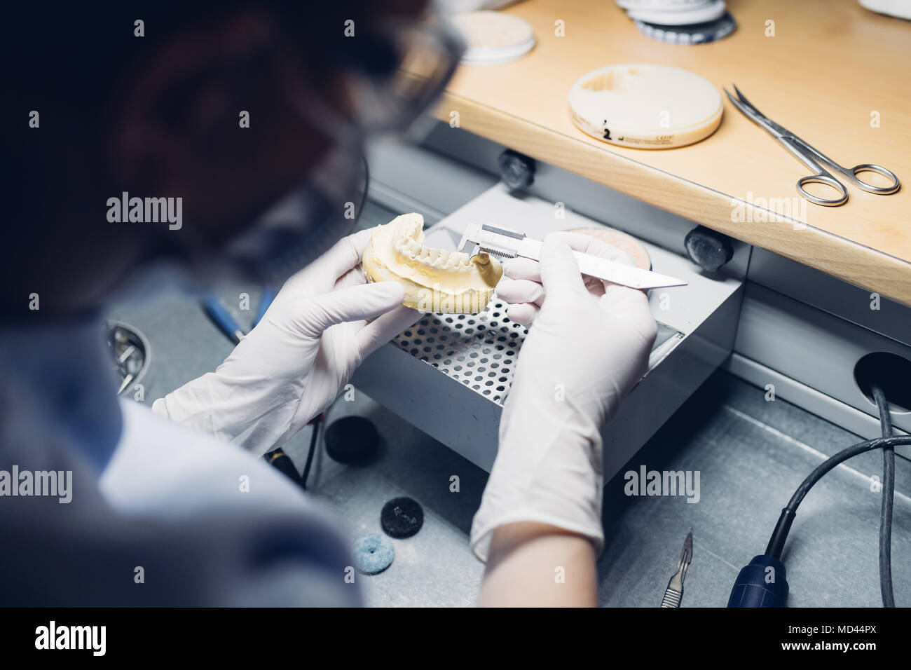 Dentist making denture in laboratory Stock Photo - Alamy