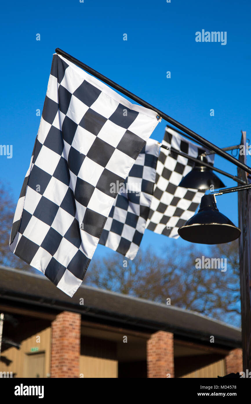 Chequered Flags with blue background Stock Photo - Alamy