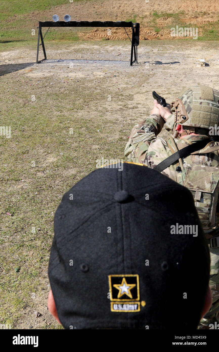 A U.S. Army Soldier shoots steel plates in a multigun match stage ...