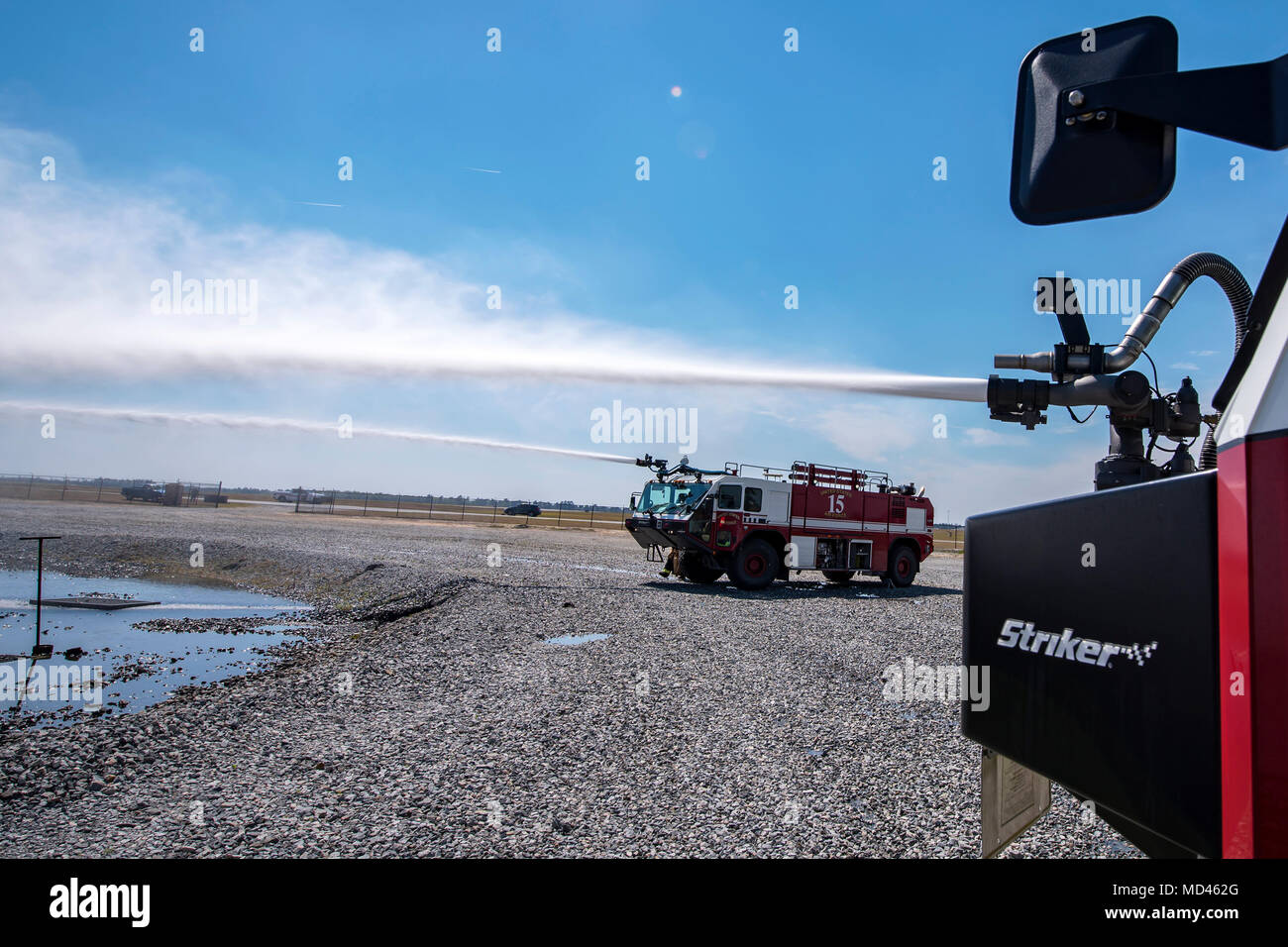 Water shoots from the hoses of Aircraft rescue firefighting vehicles ...