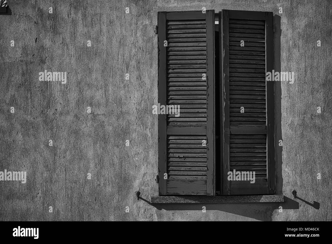 Open vintage window shutter in sunny day, italy style concrete cement ...