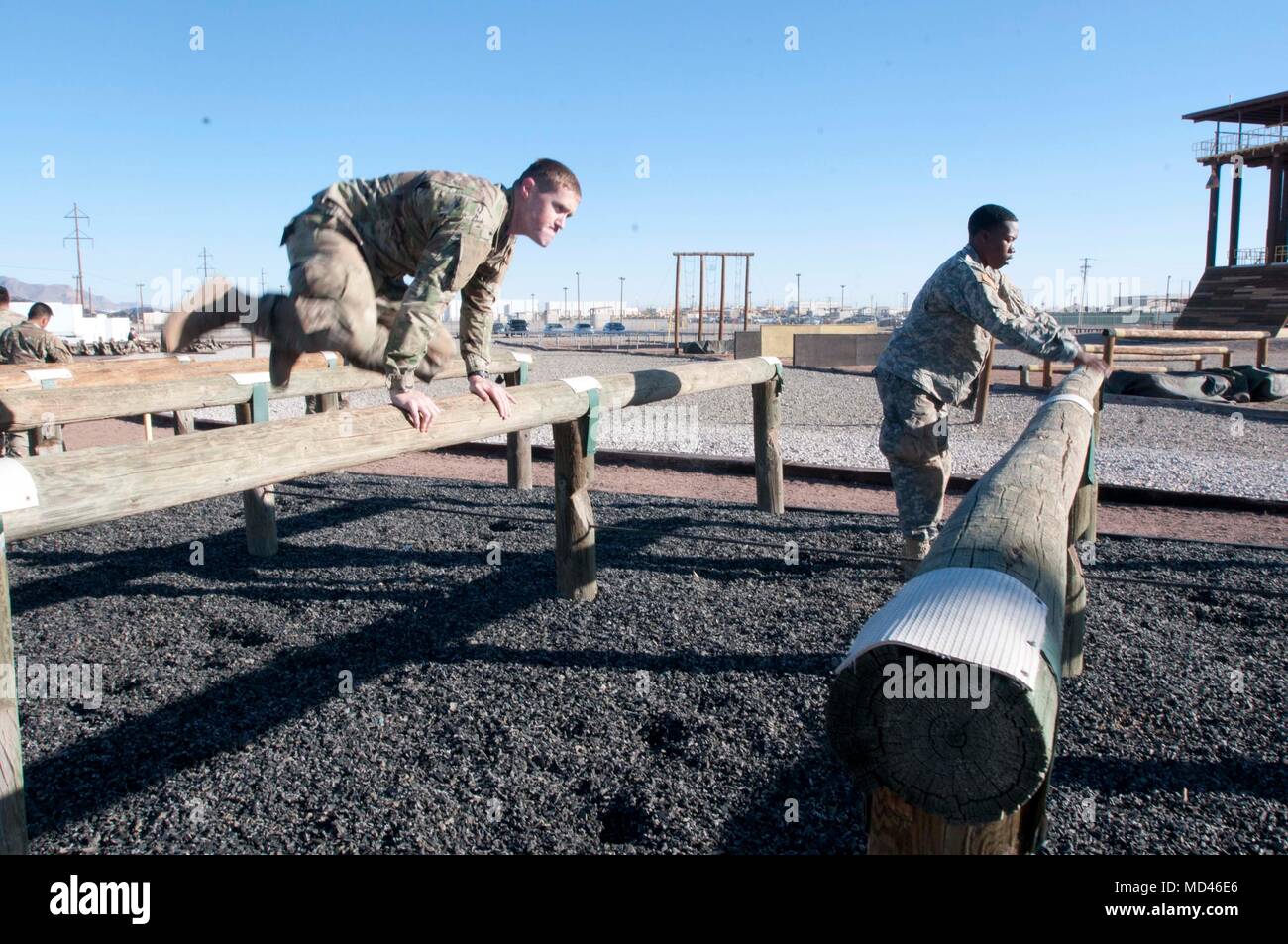 Air Assault trainees hurdle over logs during an obstacle course at the ...