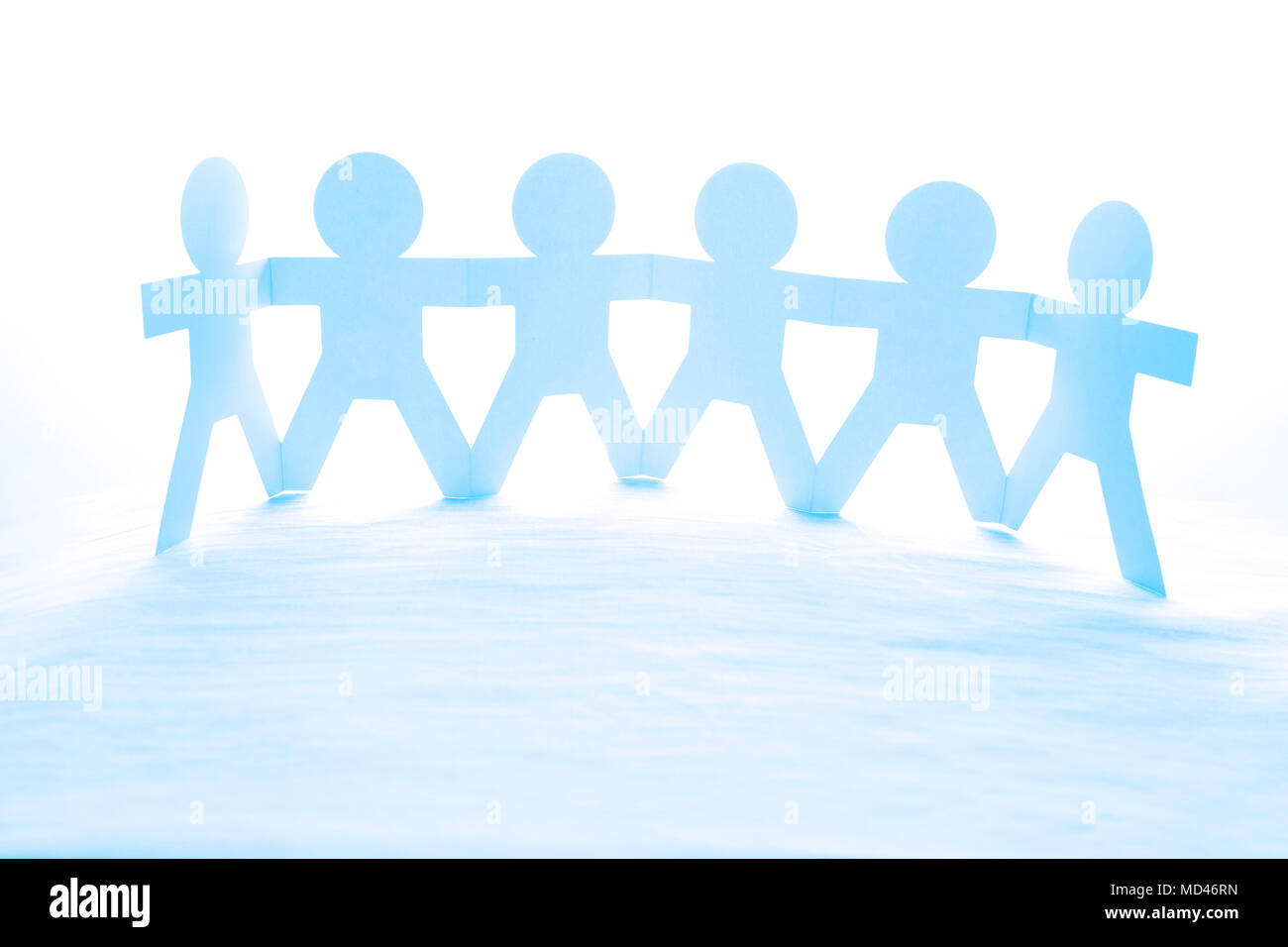 Team of paper chain people Stock Photo - Alamy