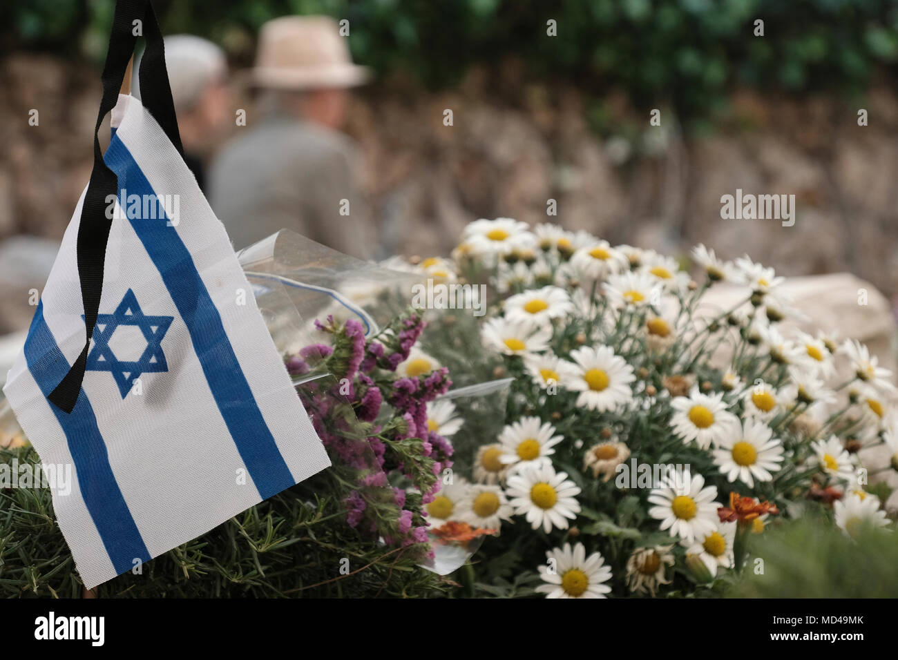 The Israeli national flag with a black mourning ribbon bearing the word ...
