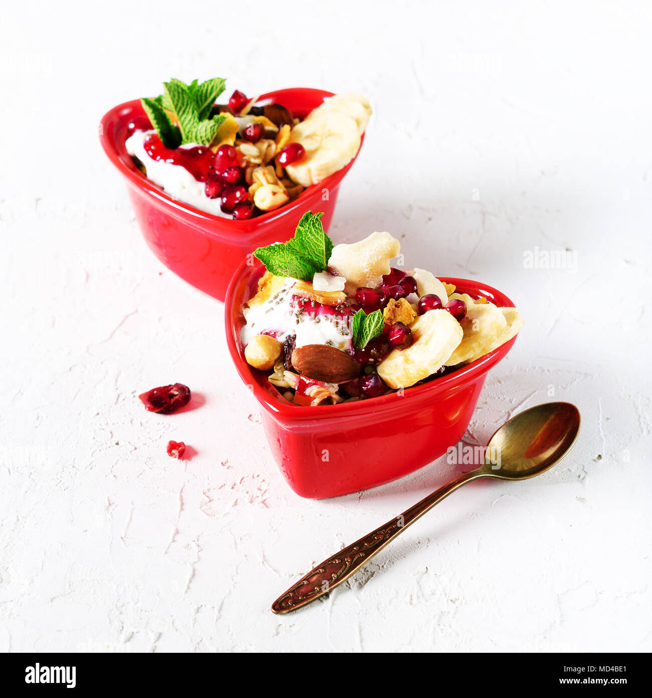 Healthy breakfast - pomegranate, yogurt, granola parfait on white ...