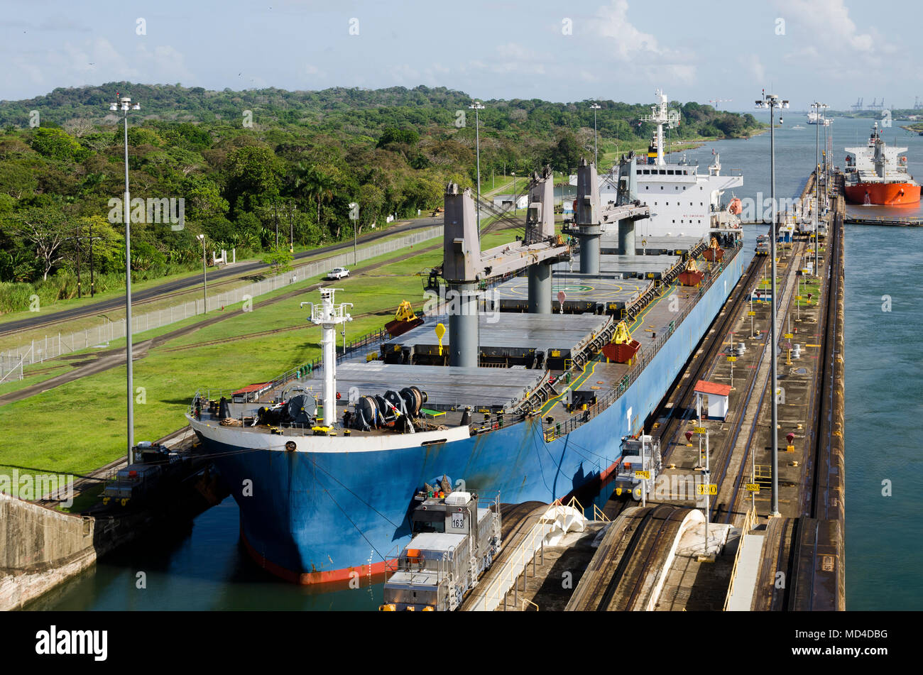 Merchant ships pass the locks of the Panama Canal Stock Photo - Alamy