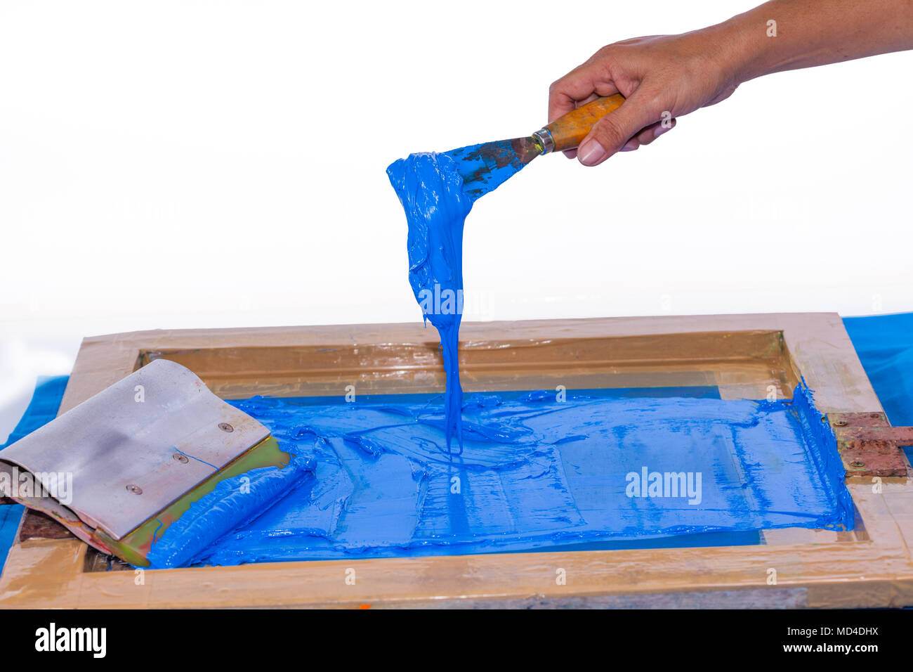 hand made screen printing with blue color print on blue tee shirt Stock ...