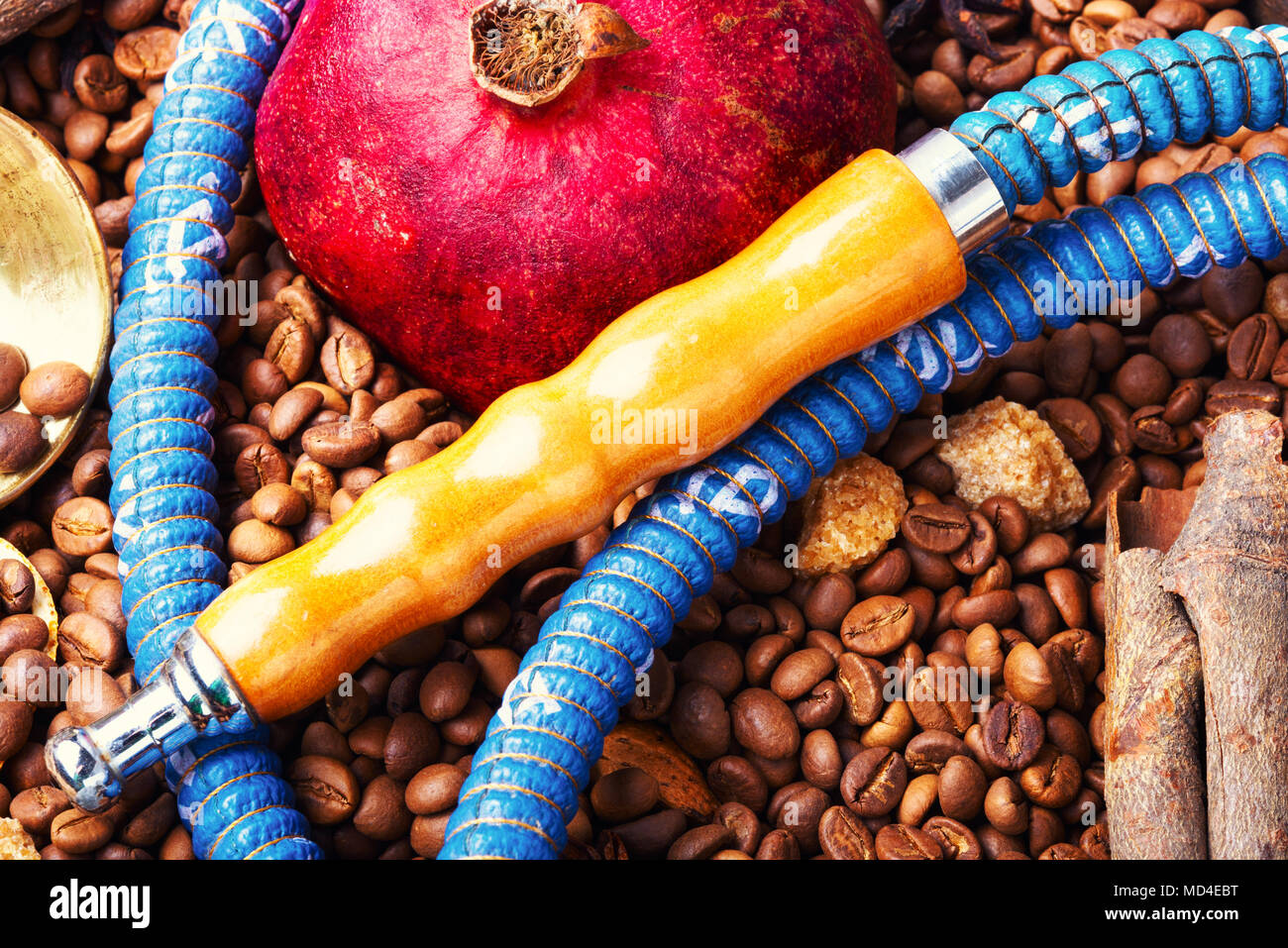 Smoke hookah with with coffee beans and pomegranate.Shisha concept ...