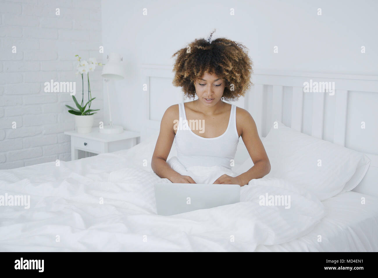 Woman bed bedroom lounge hi-res stock photography and images - Alamy