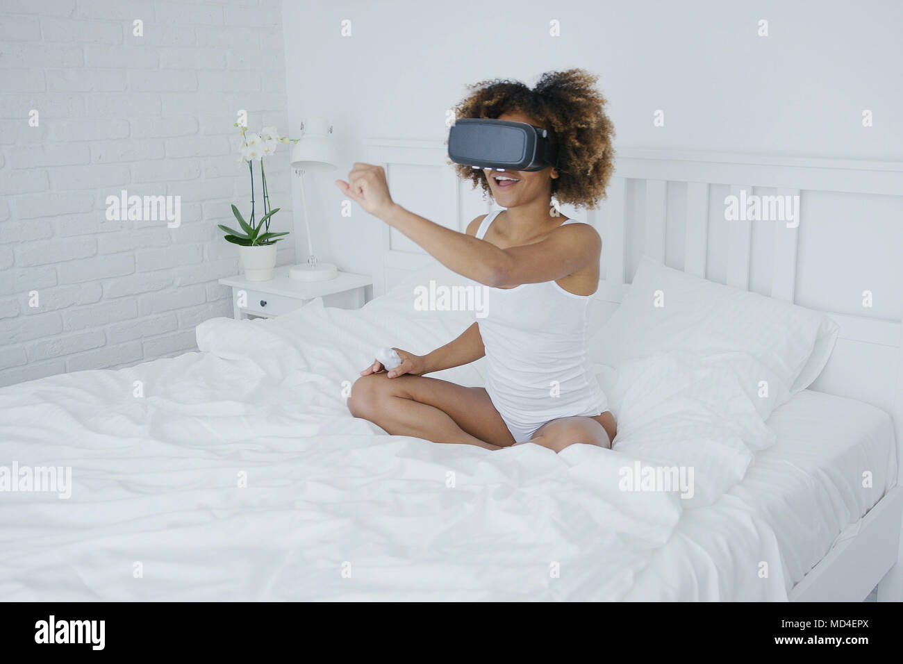 Woman bed headset hi-res stock photography and images - Alamy
