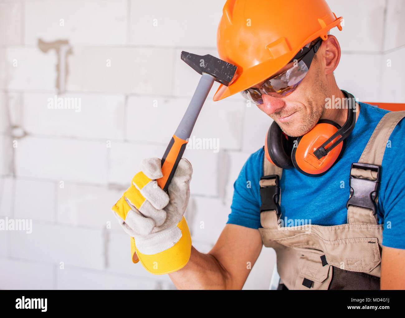 Construction Worker Theme. Caucasian Builder with Hammer Wearing Safety ...