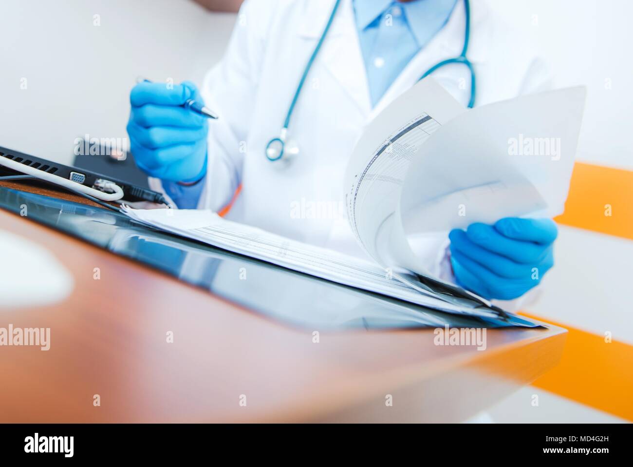 Medical Doctor Browsing Laboratory Data on His Desk. Healthcare Theme ...