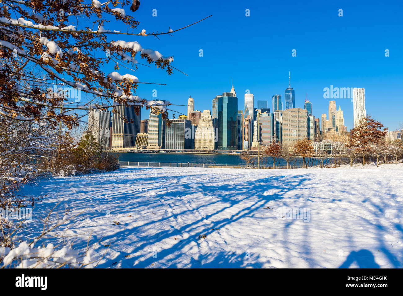 Lower Manhattan skyline panorama in snowy winter time from Brooklyn ...