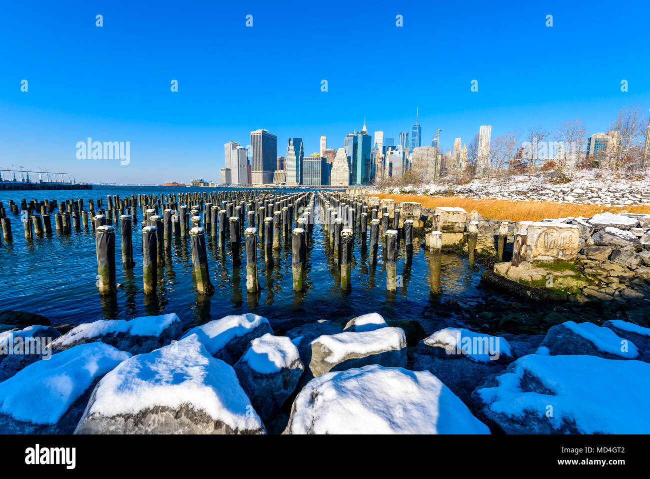Lower Manhattan skyline panorama in snowy winter time from Brooklyn ...
