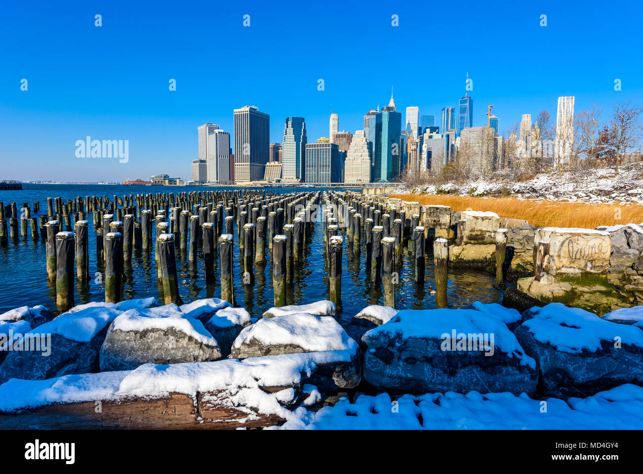 Lower Manhattan skyline panorama in snowy winter time from Brooklyn ...