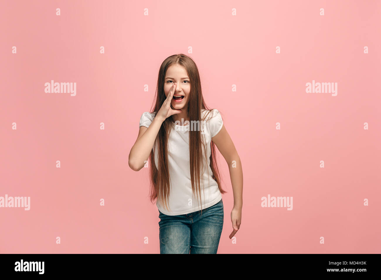 young casual teen girl shouting at studio Stock Photo - Alamy