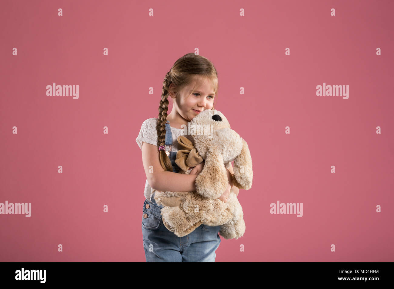 Girl hugging stuffed toy hi-res stock photography and images - Alamy