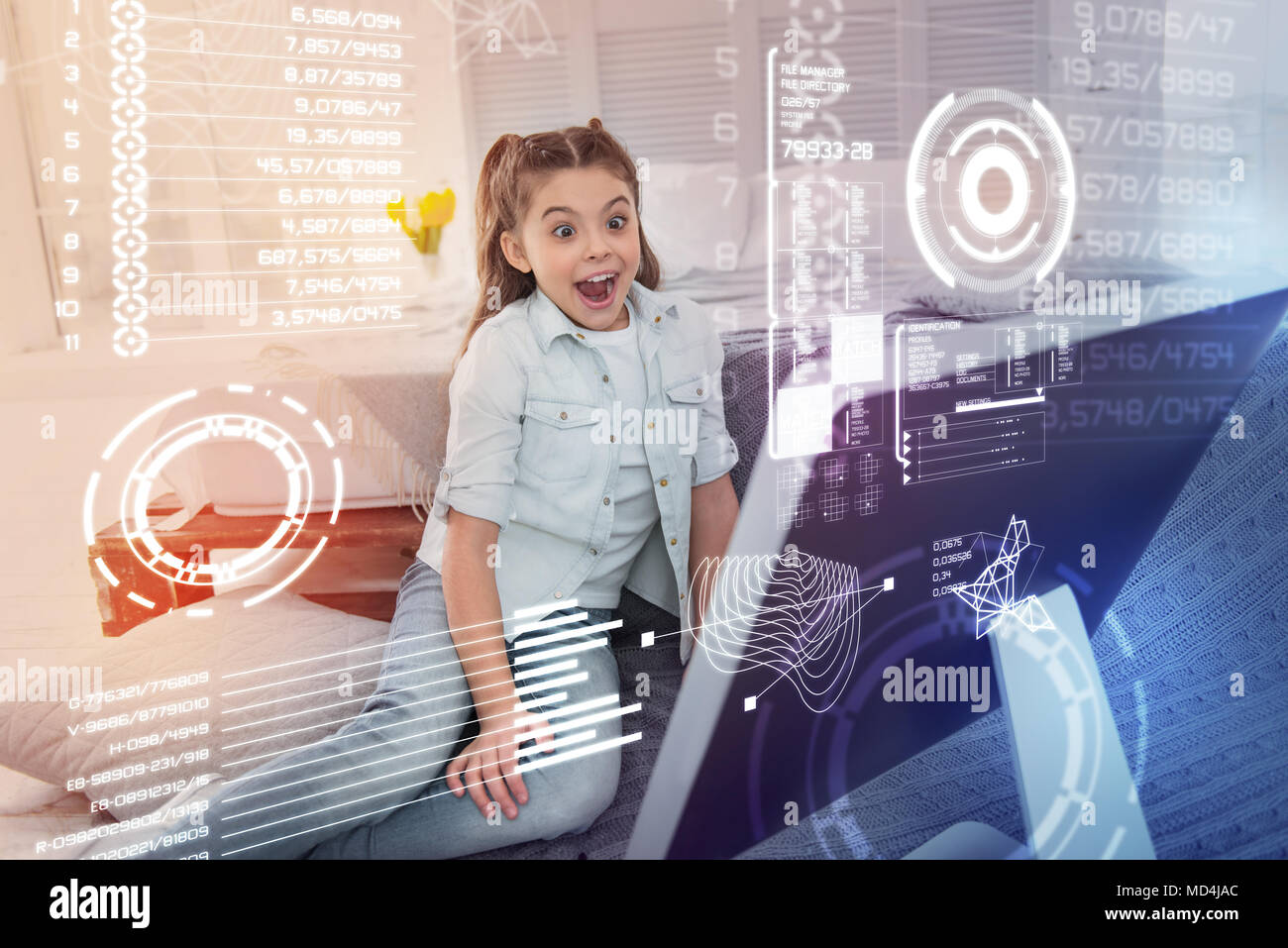 Emotional girl feeling excited while seeing a new modern computer Stock ...