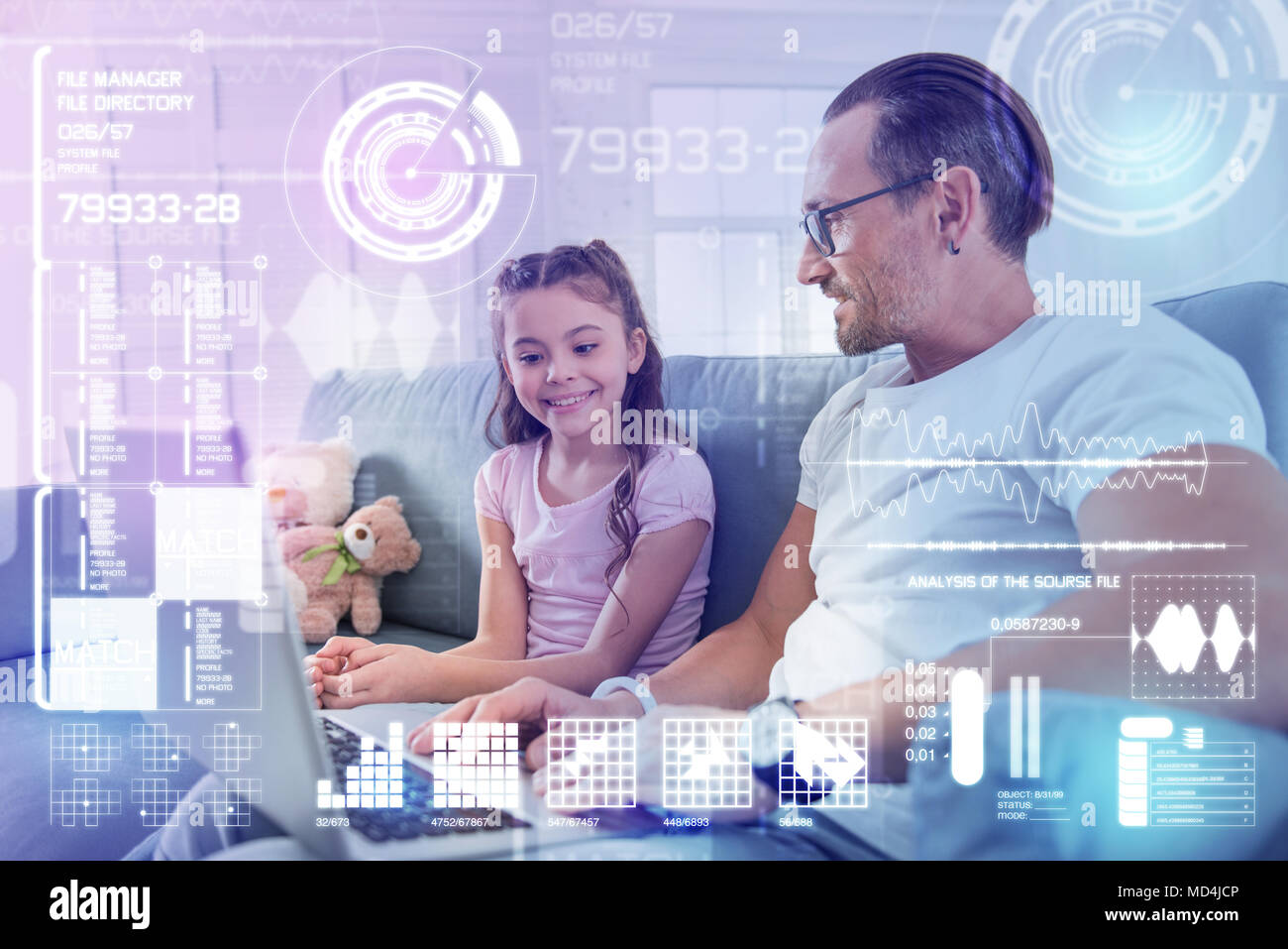 Progressive father watching cartoons with his child Stock Photo - Alamy
