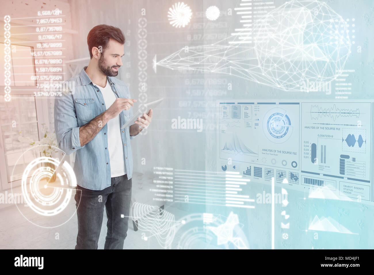 Happy programmer smiling while creating holograms Stock Photo - Alamy