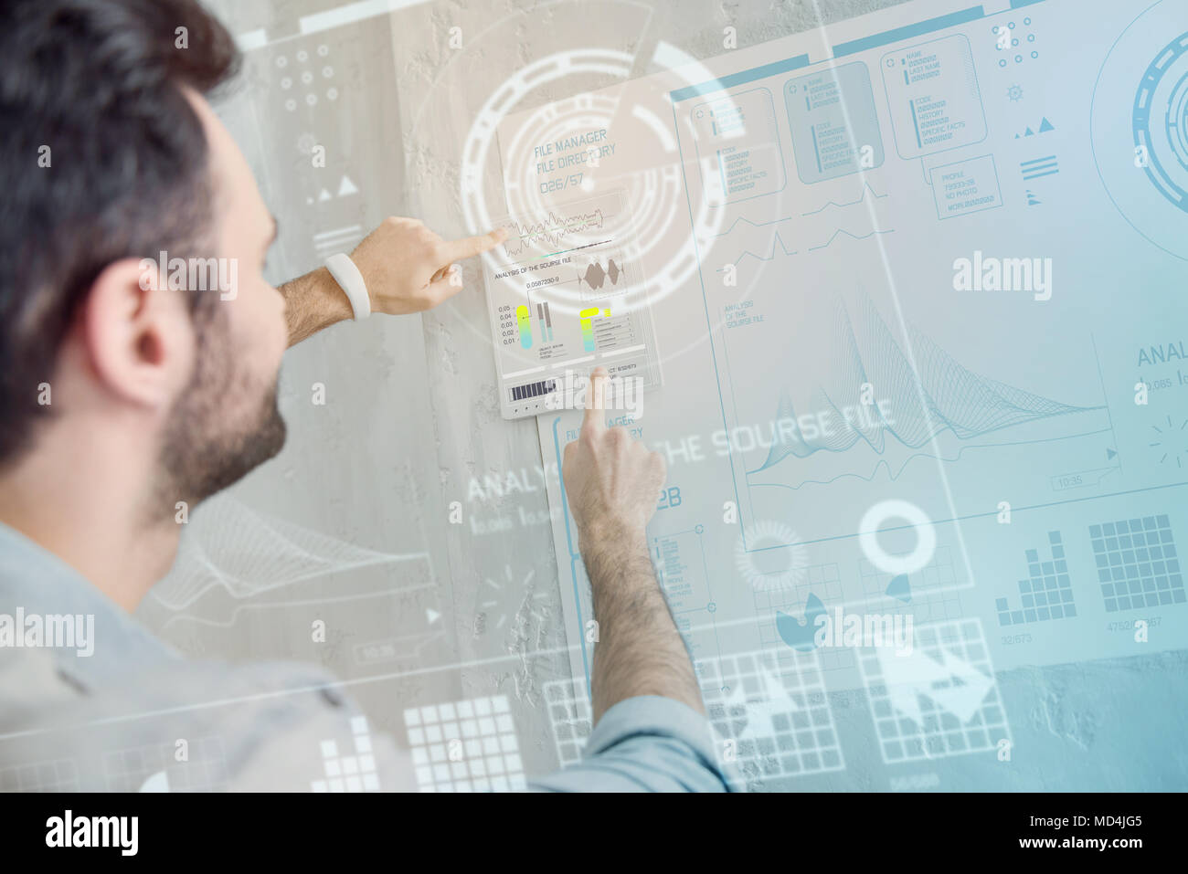 Analytics manager drawing graphics while working Stock Photo - Alamy