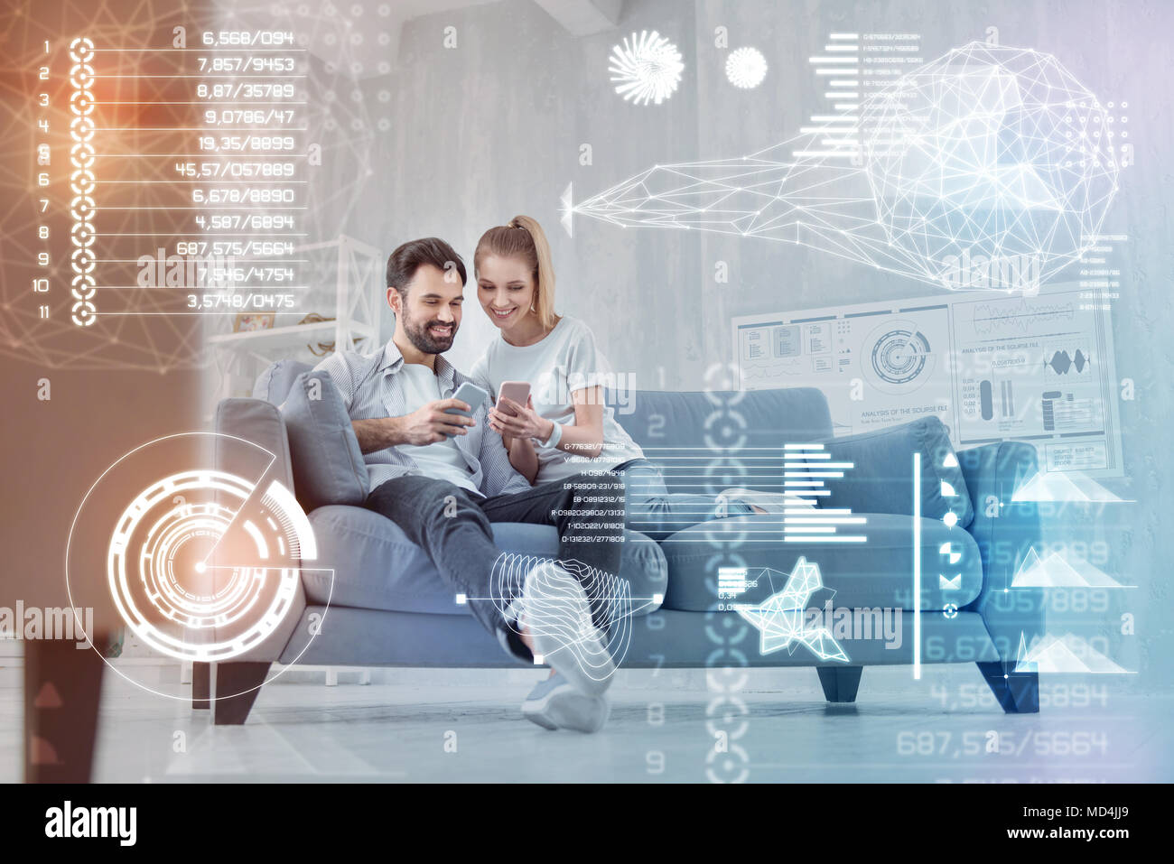 Positive people smiling while looking at their photos Stock Photo - Alamy