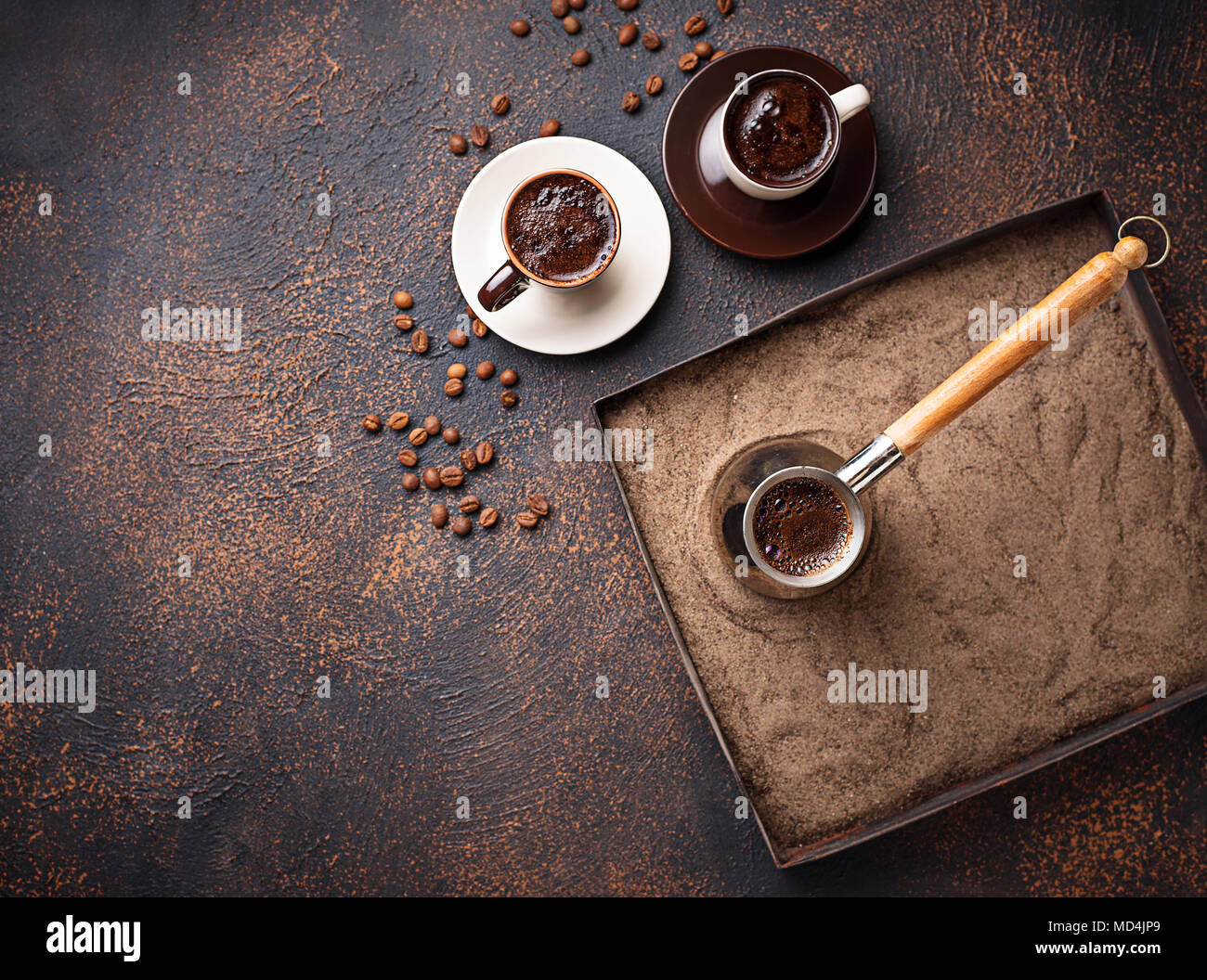Traditional turkish coffee prepared on hot sand Stock Photo - Alamy