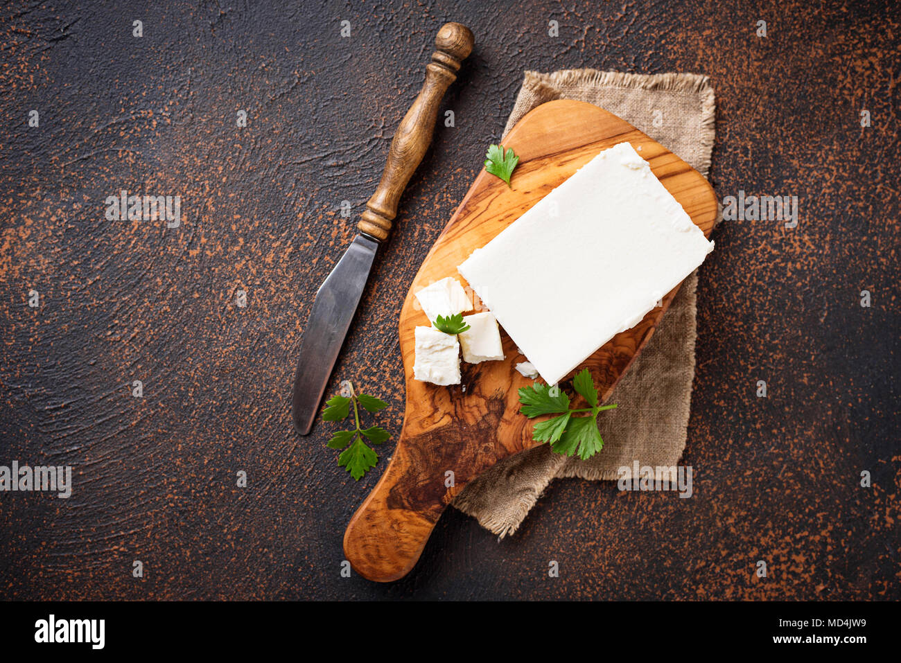 Feta cheese on rusty background Stock Photo - Alamy